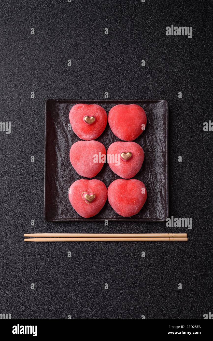 Delicious sweet mochi in the shape of red hearts for the holiday of ...
