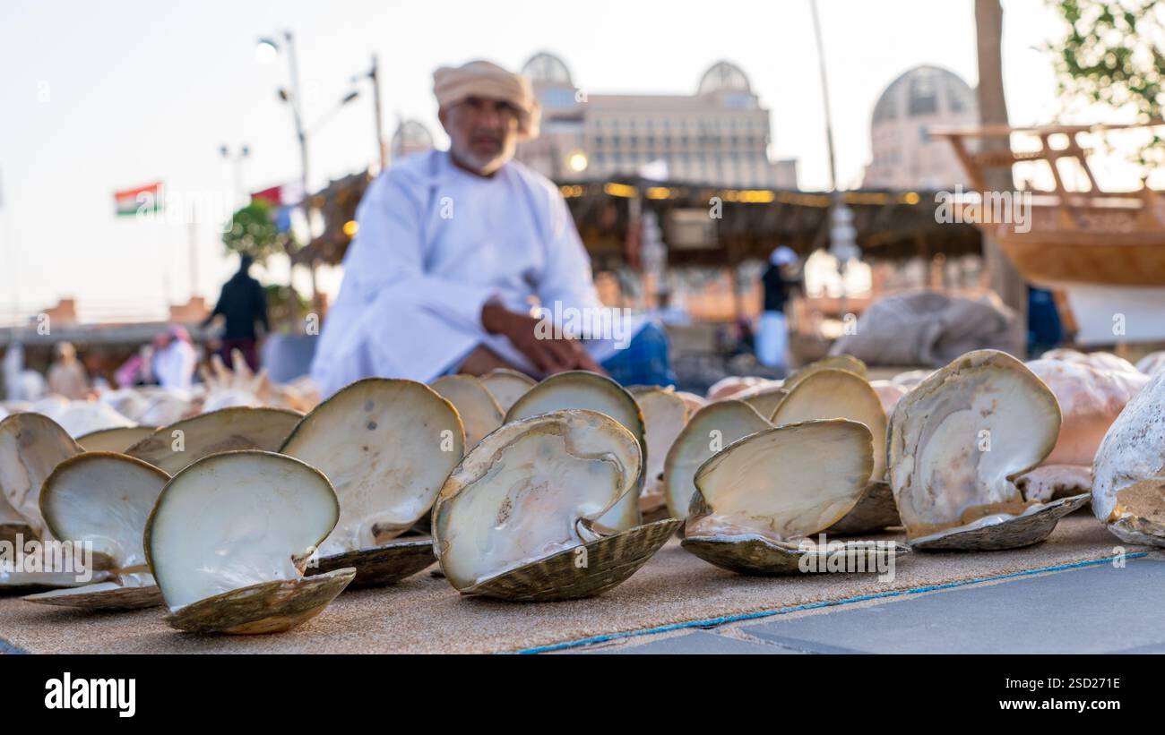 Doha,qatar -February 7, 2025: A merchant displaying sea shells and ...