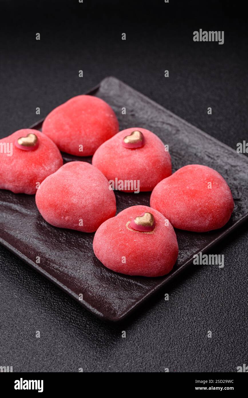 Delicious sweet mochi in the shape of red hearts for the holiday of ...