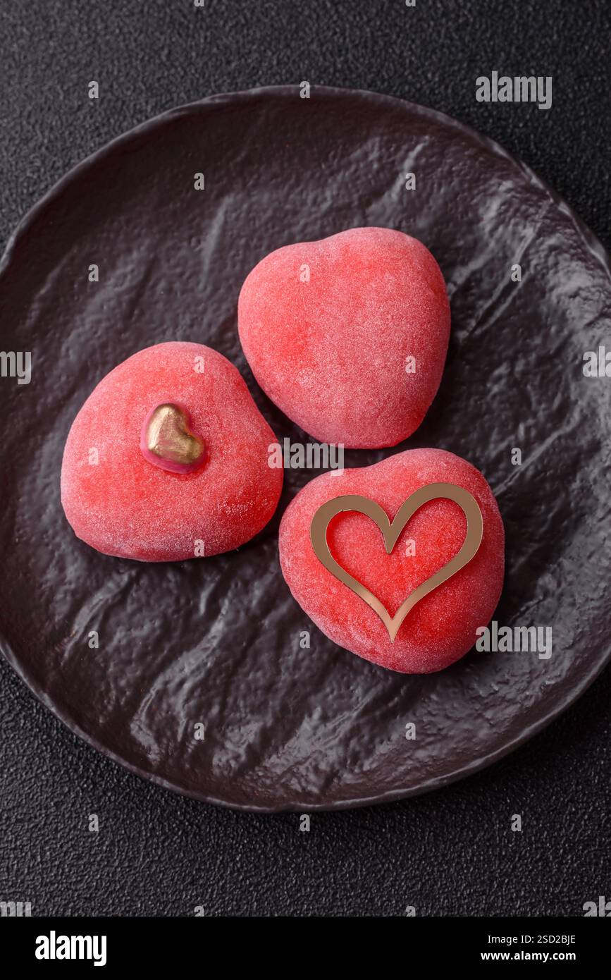 Delicious sweet mochi in the shape of red hearts for the holiday of ...