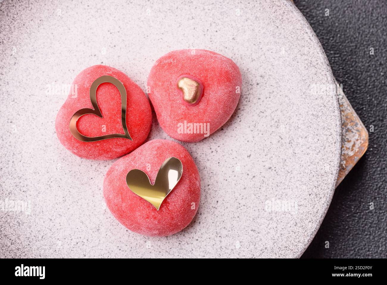Delicious sweet mochi in the shape of red hearts for the holiday of ...