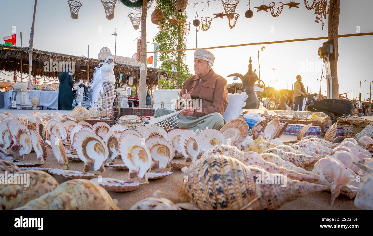 Doha,qatar -February 7, 2025: A merchant displaying sea shells and ...