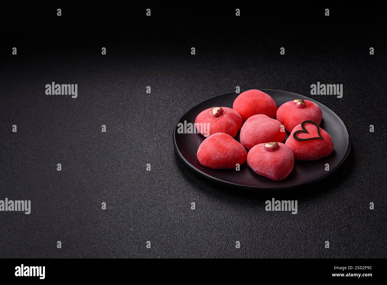 Delicious sweet mochi in the shape of red hearts for the holiday of ...