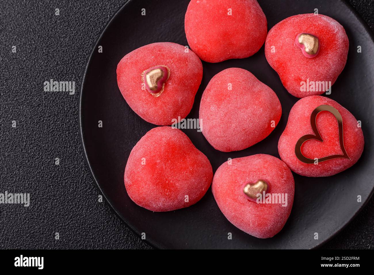 Delicious sweet mochi in the shape of red hearts for the holiday of ...