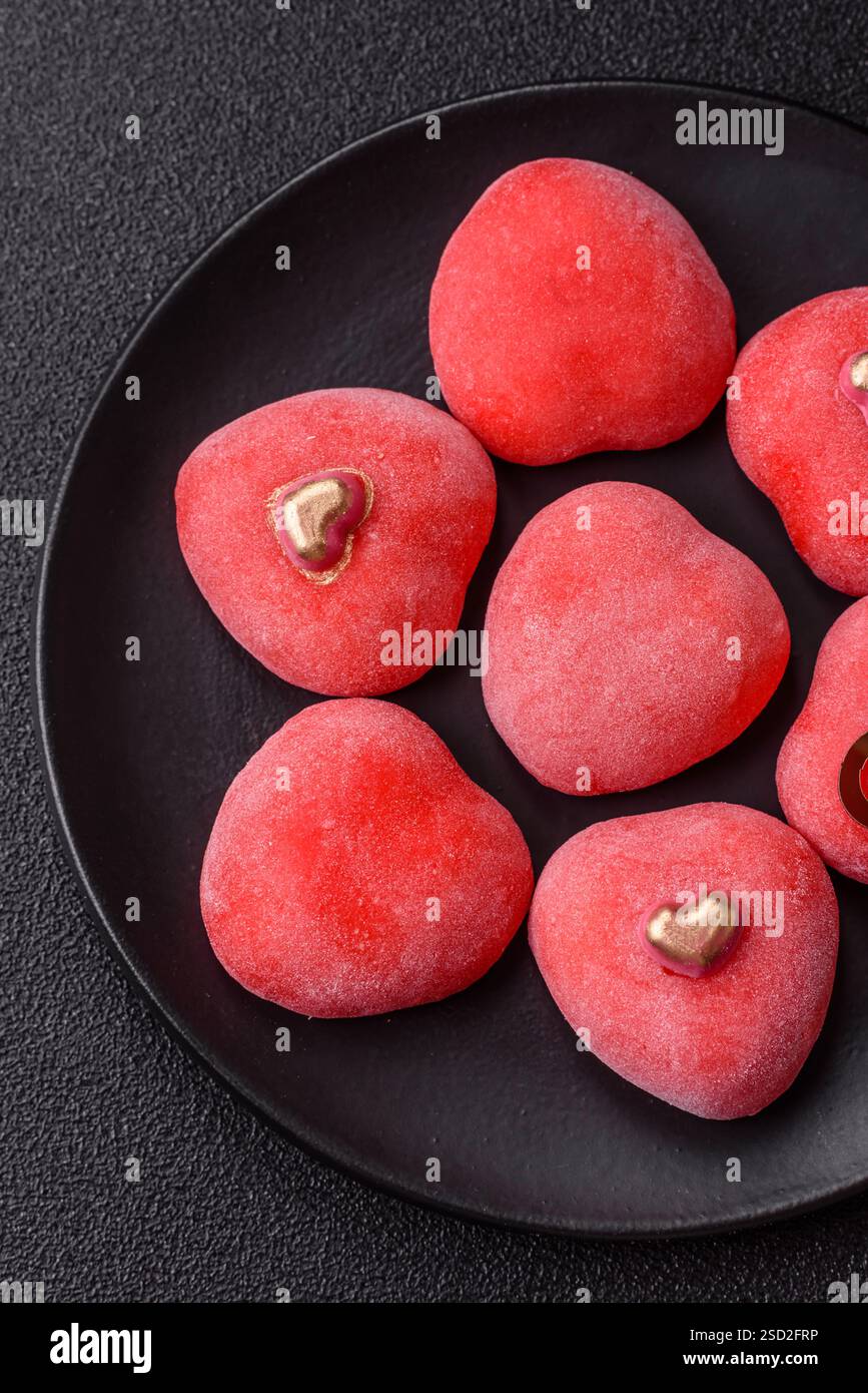 Delicious sweet mochi in the shape of red hearts for the holiday of ...