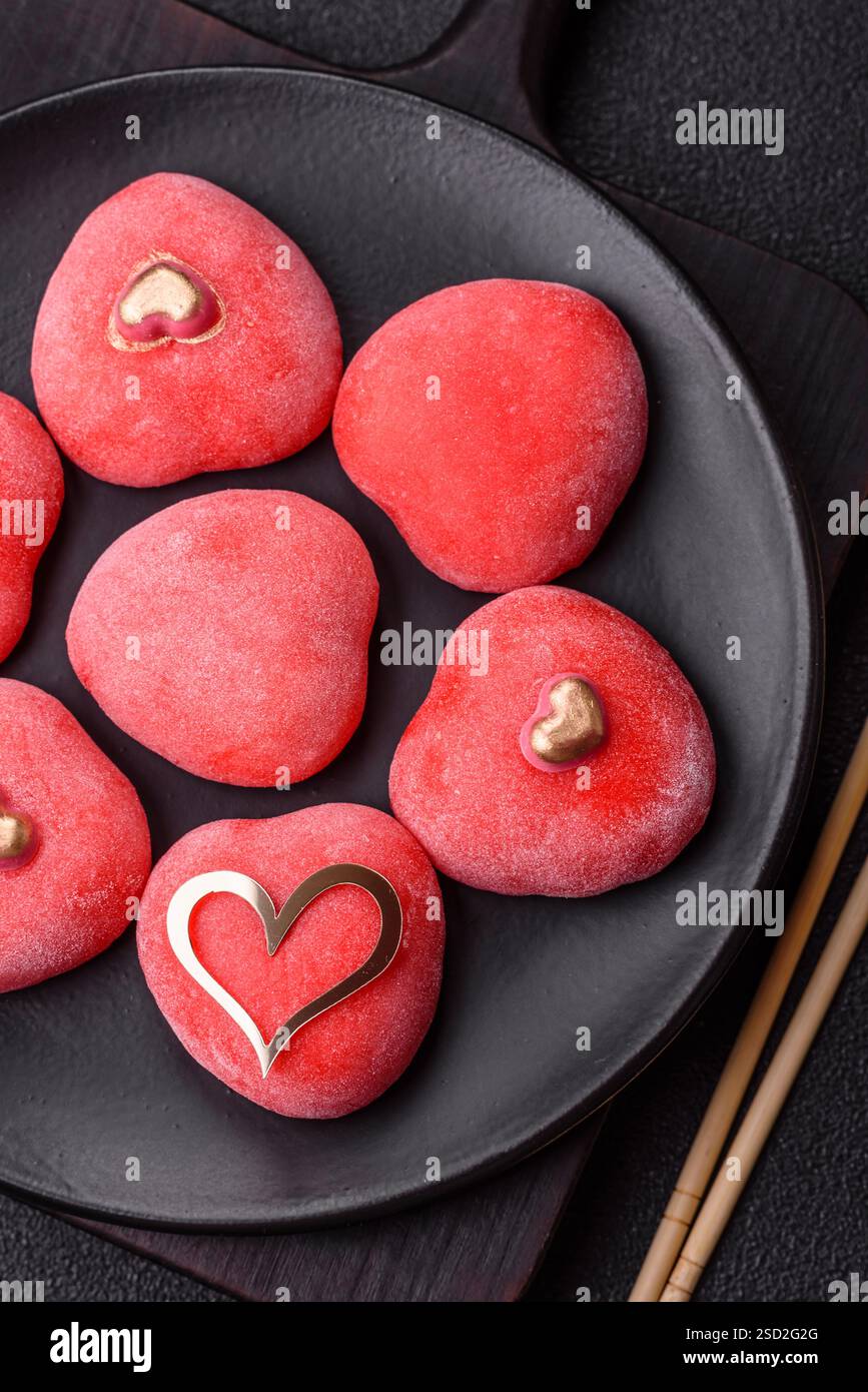 Delicious sweet mochi in the shape of red hearts for the holiday of ...