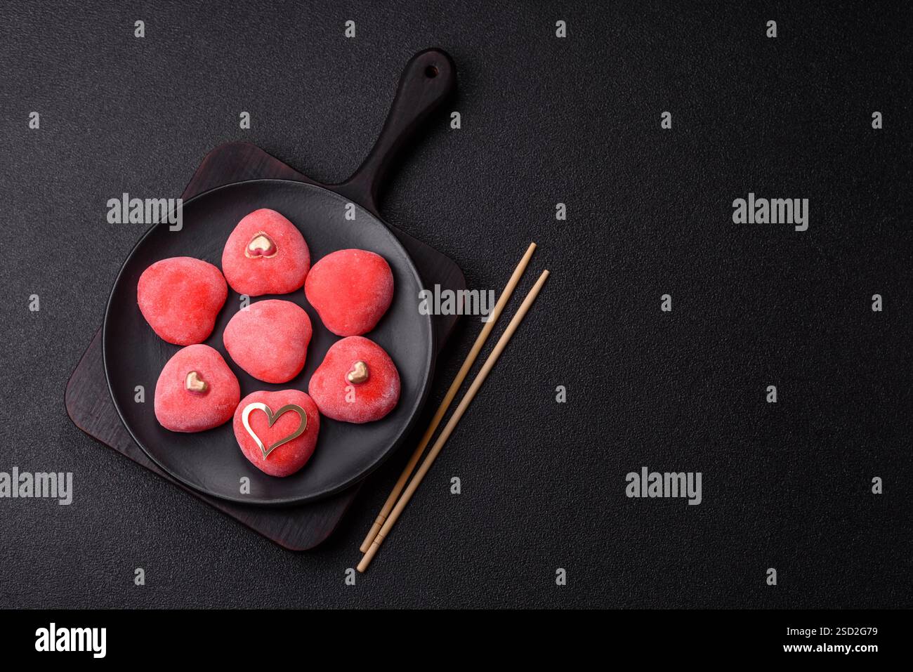 Delicious sweet mochi in the shape of red hearts for the holiday of ...