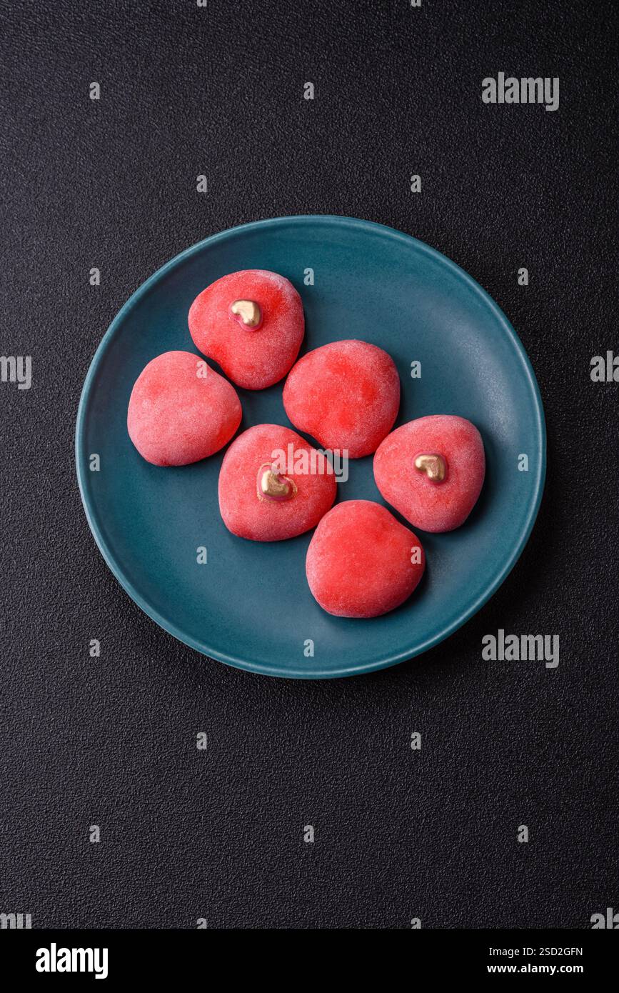 Delicious sweet mochi in the shape of red hearts for the holiday of ...
