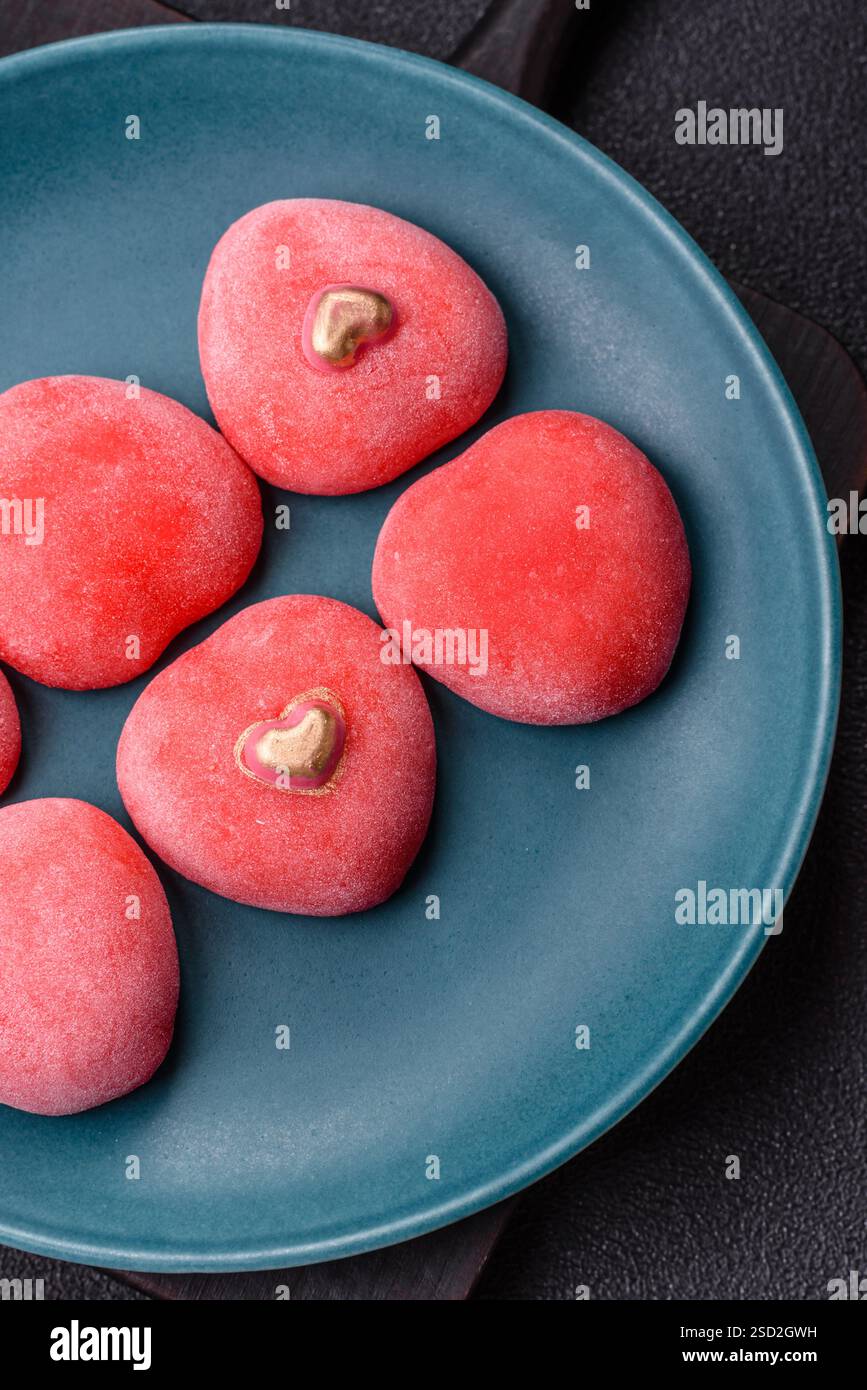 Delicious sweet mochi in the shape of red hearts for the holiday of ...