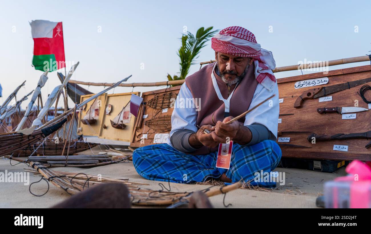 Doha,qatar -February 7, 2025: A merchant displaying sea shells and ...