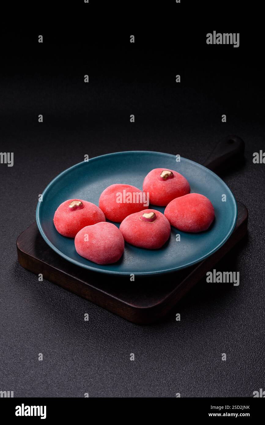 Delicious sweet mochi in the shape of red hearts for the holiday of ...