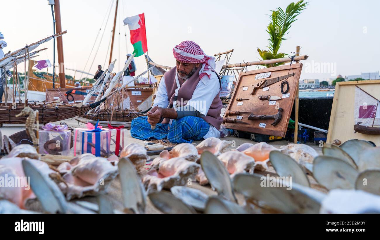 Doha,qatar -February 7, 2025: A merchant displaying sea shells and ...