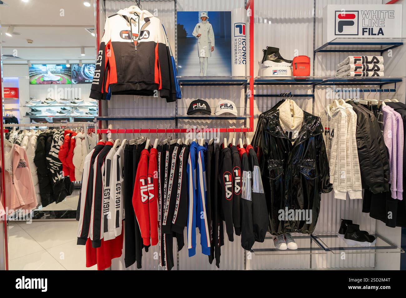 Shenzhen, China - January 11, 2019: various clothing items displayed inside Fila store at Vanke ...