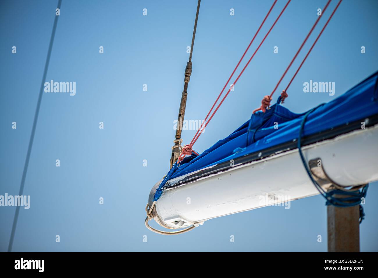 A detailed view of the essential components of a sail, including ropes ...