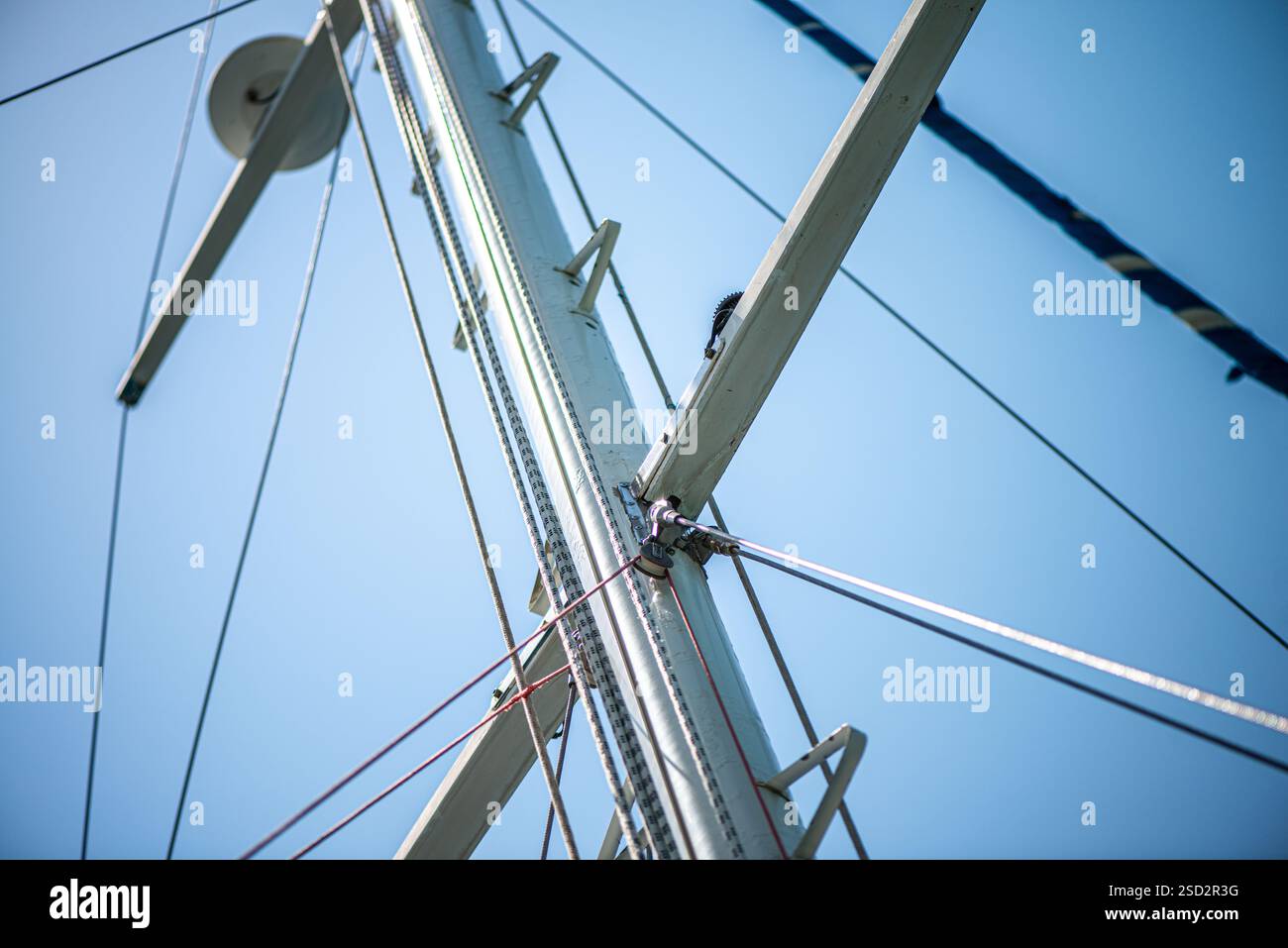 A close-up view of strong, weathered ropes tightly secured around a ...