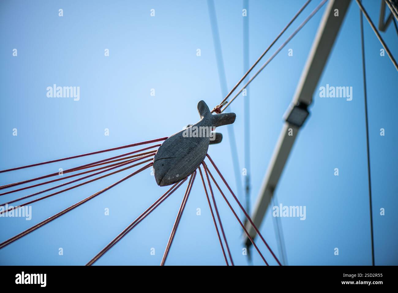 A close-up view of strong, weathered ropes tightly secured around a ...
