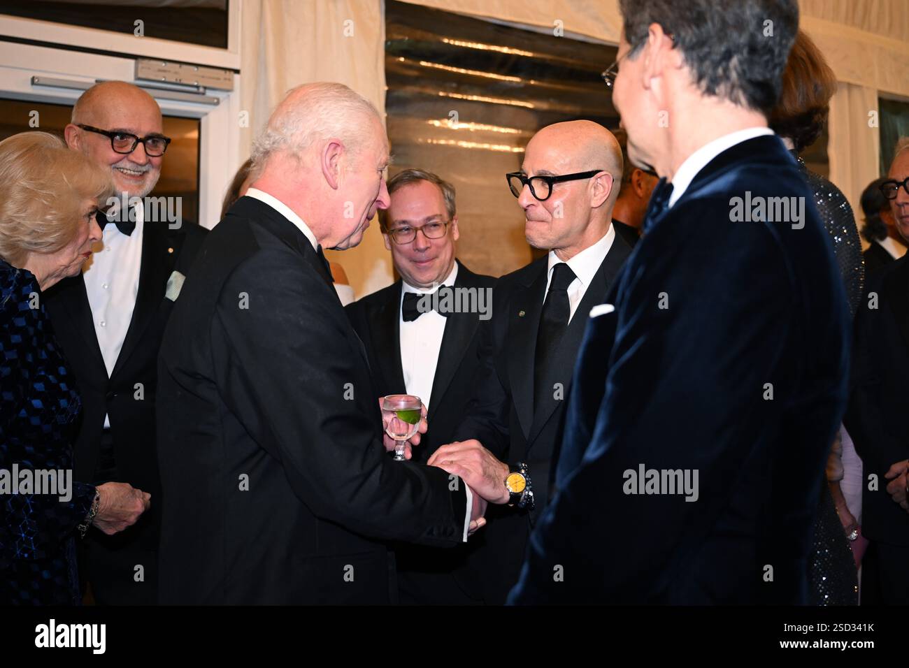 King Charles III greets Hollywood star Stanley Tucci during a dinner in ...