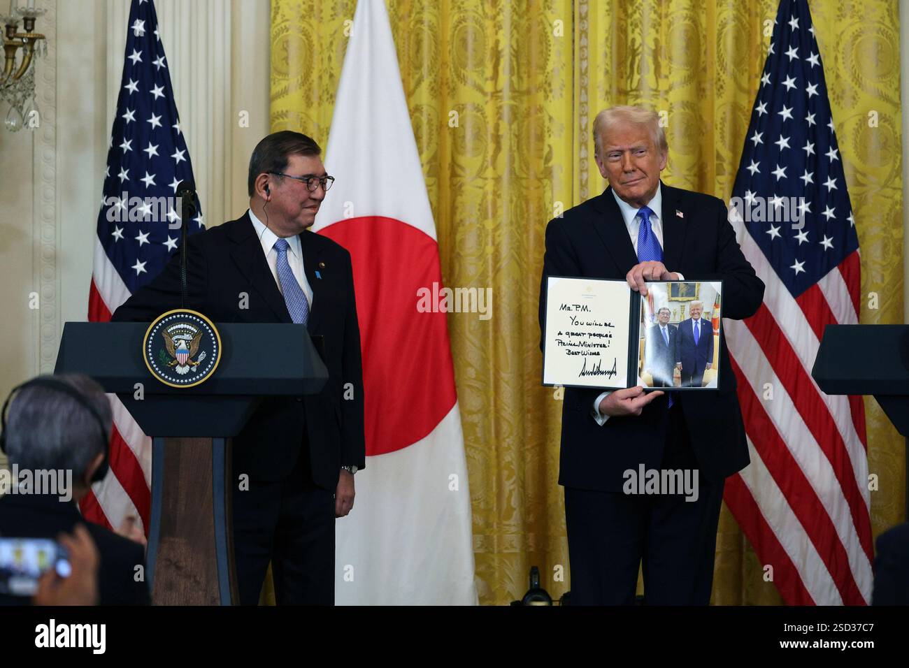 Japanese Prime Minister Shigeru Ishiba (L) and U.S. President Donald ...