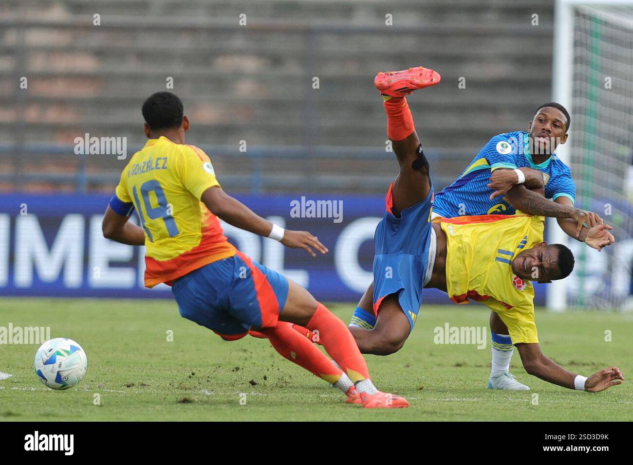 Colombia's Andy Batioja, right, falls as he pursues the ball alongside ...