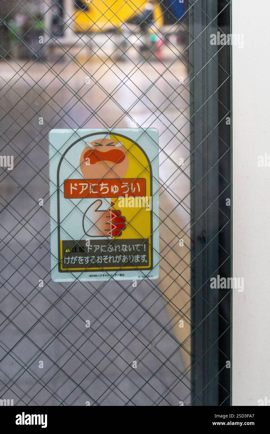 Tokyo, Japan - Jan 3rd 2025: Notice of safety precautions on a door in ...