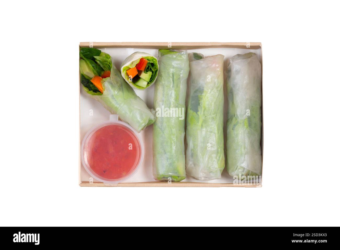 Spring rolls with avocado and spinach. Packed in a cardboard box from ...