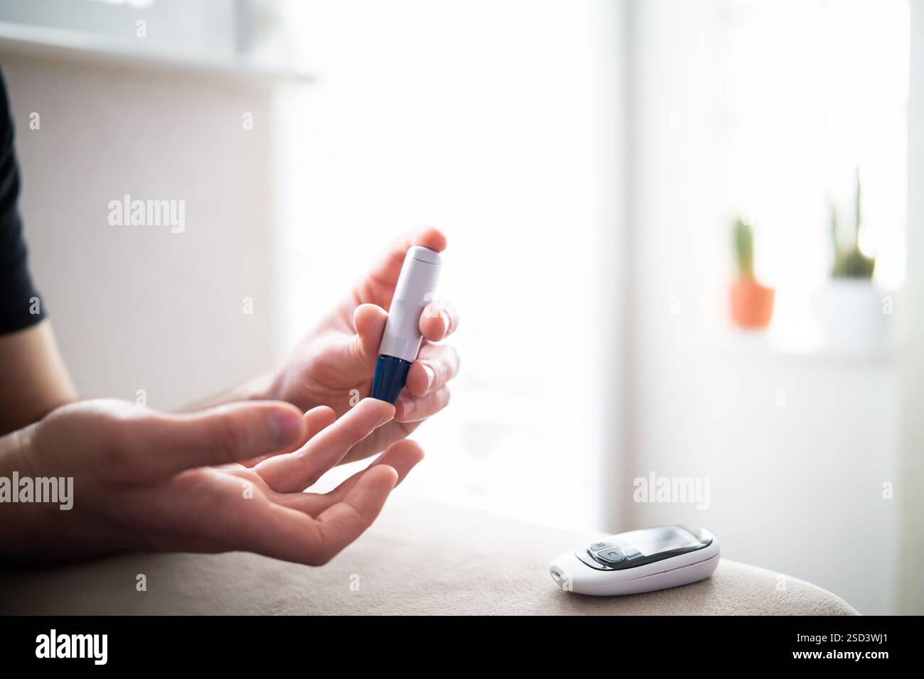Close-up Of A Man's Hand Checking Blood Sugar Level With Glucometer ...