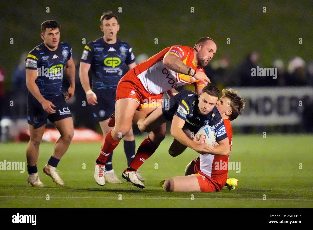 Wigan Warriors' Jai Field is tackled by Sheffield Eagles' Tyler ...