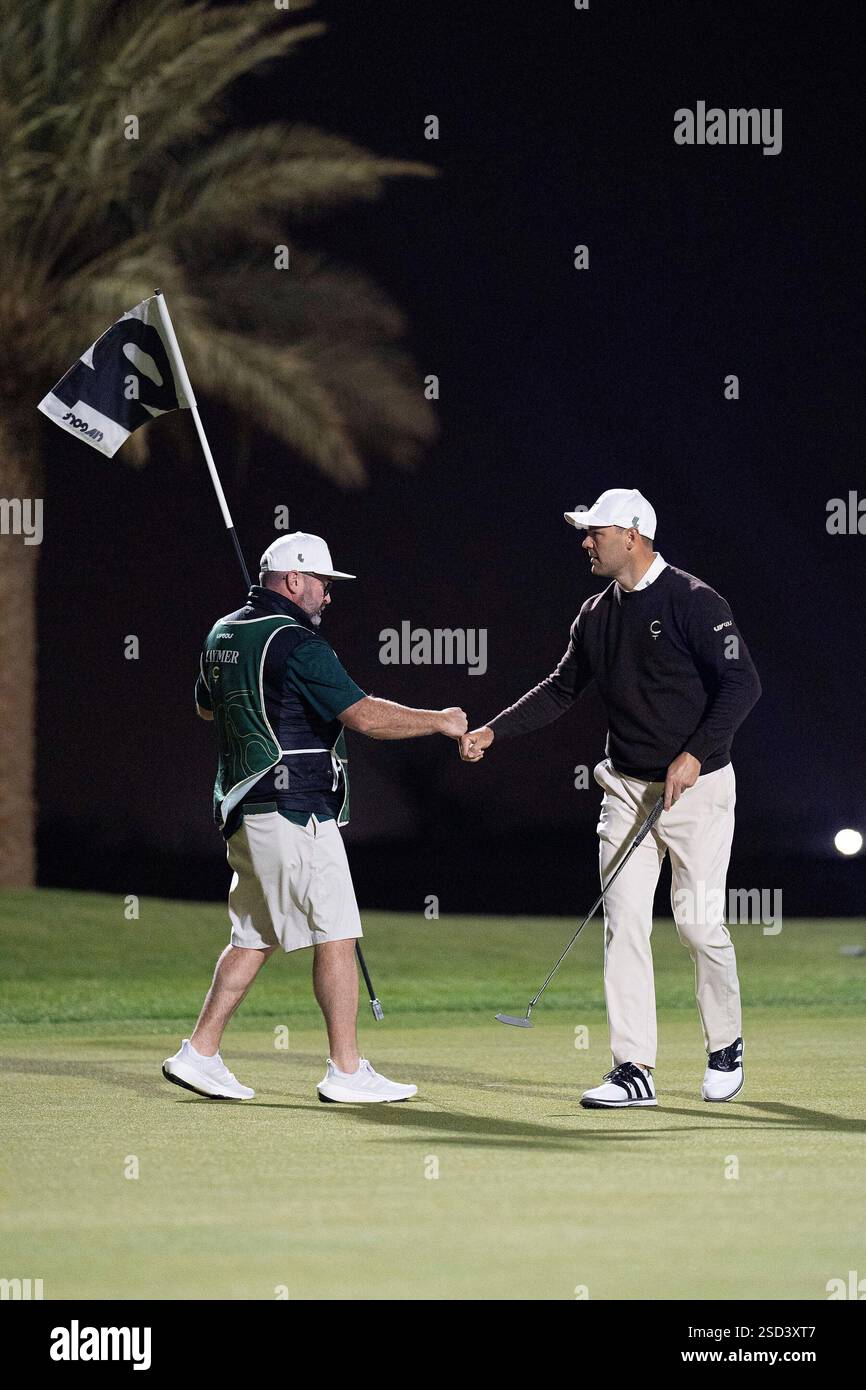 Captain Martin Kaymer of Cleeks GC and caddie, Craig Connelly, fist ...