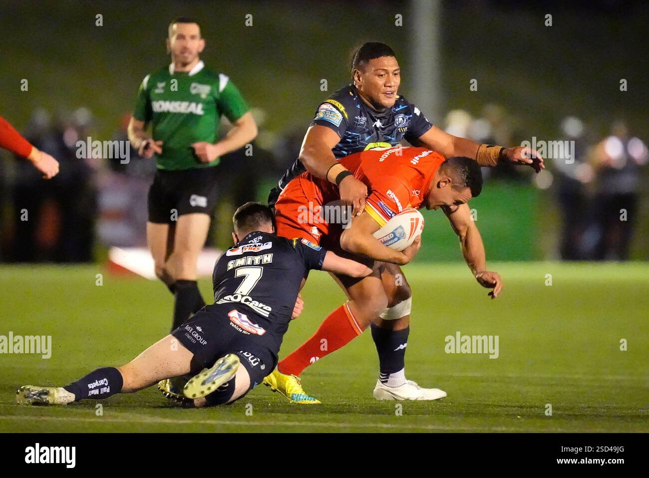 Sheffield Eagles' Ben Jones-Bishop is tackled by Wigan Warriors' Harry ...