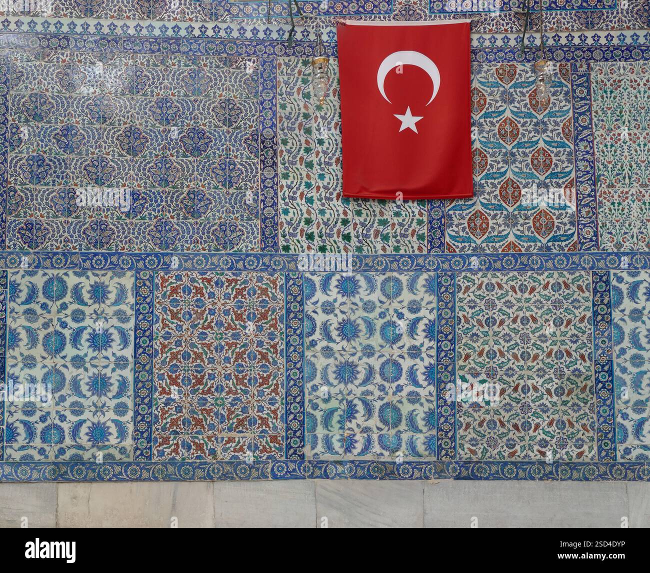 Istanbul - sep 22, 2024 - turkish flag draping over intricate iznik ...