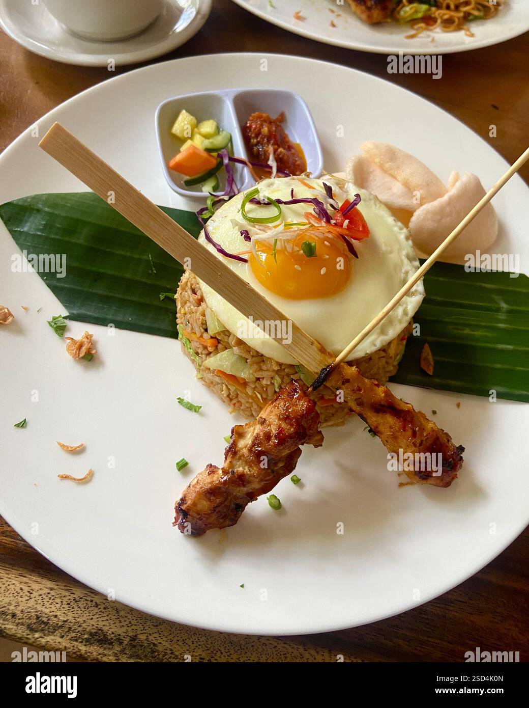 Traditional Indonesian Nasi Goreng with Fried Egg, Satay Skewers, and ...