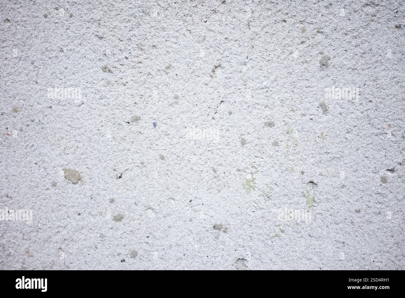 This surface features a light gray tone, exhibiting a rough texture ...