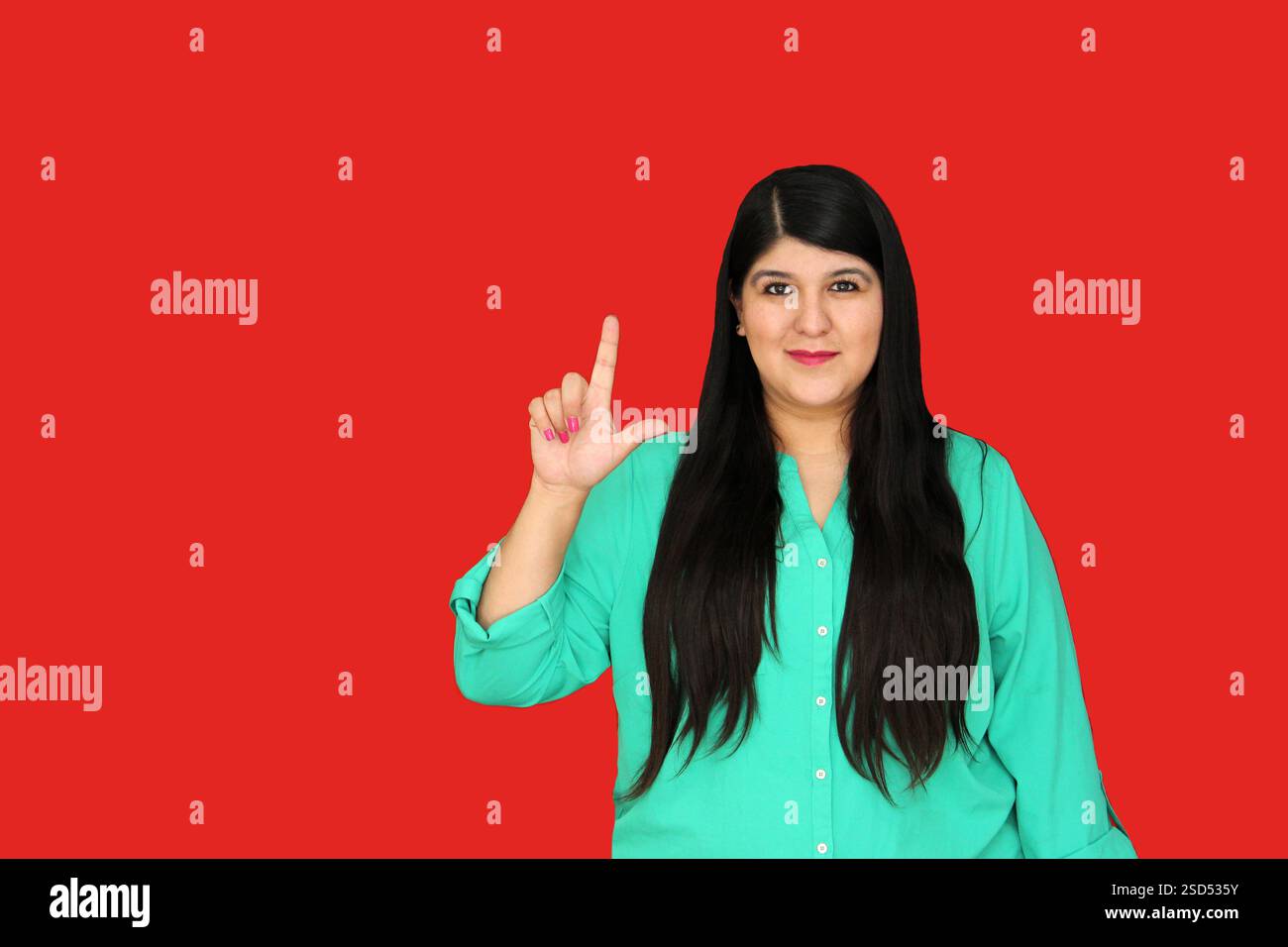Young adult woman in her 30s uses the Mexican Sign Language used by ...