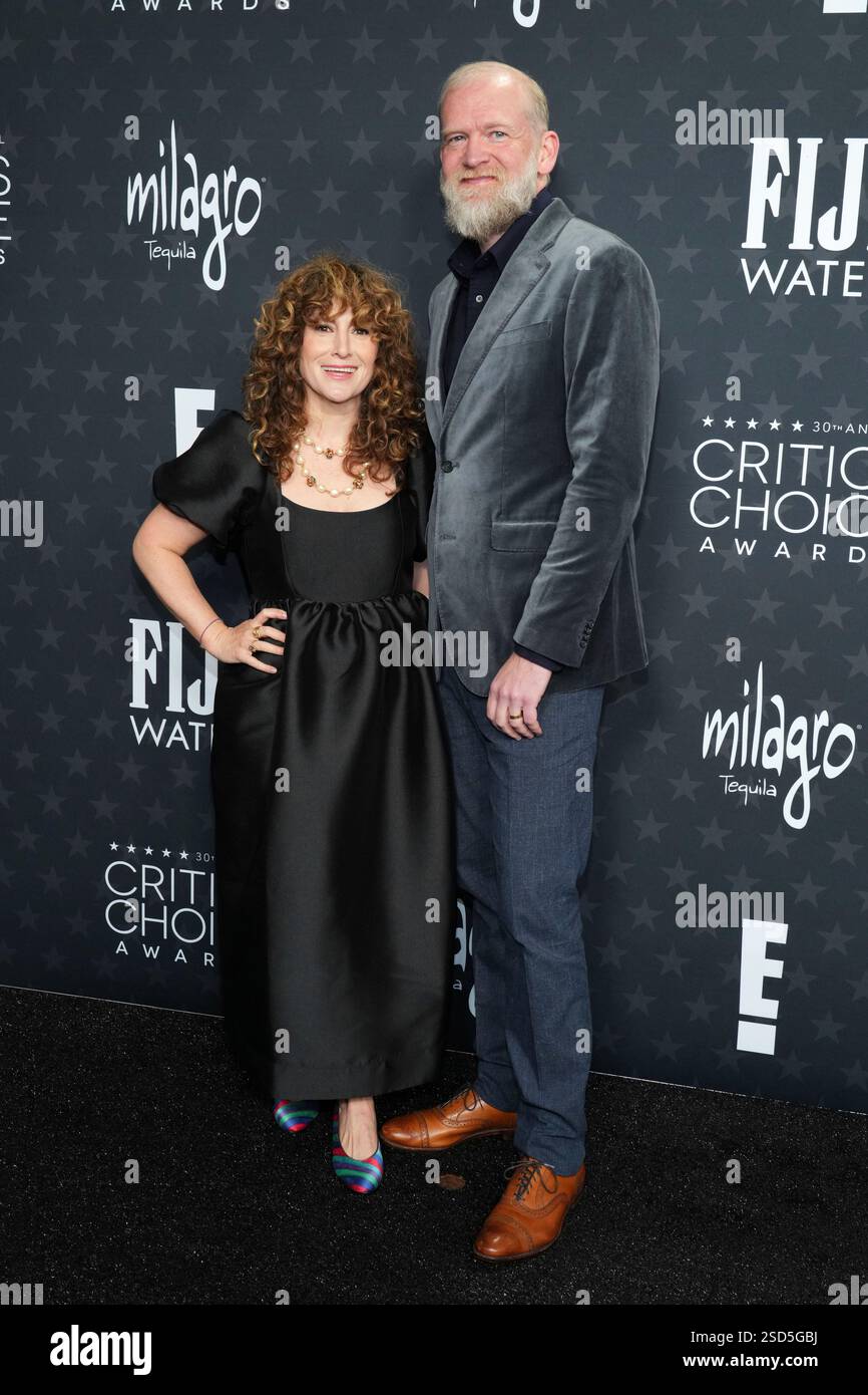 Hannah Bos, left, and Paul Thureen arrive at the 30th Critics Choice ...