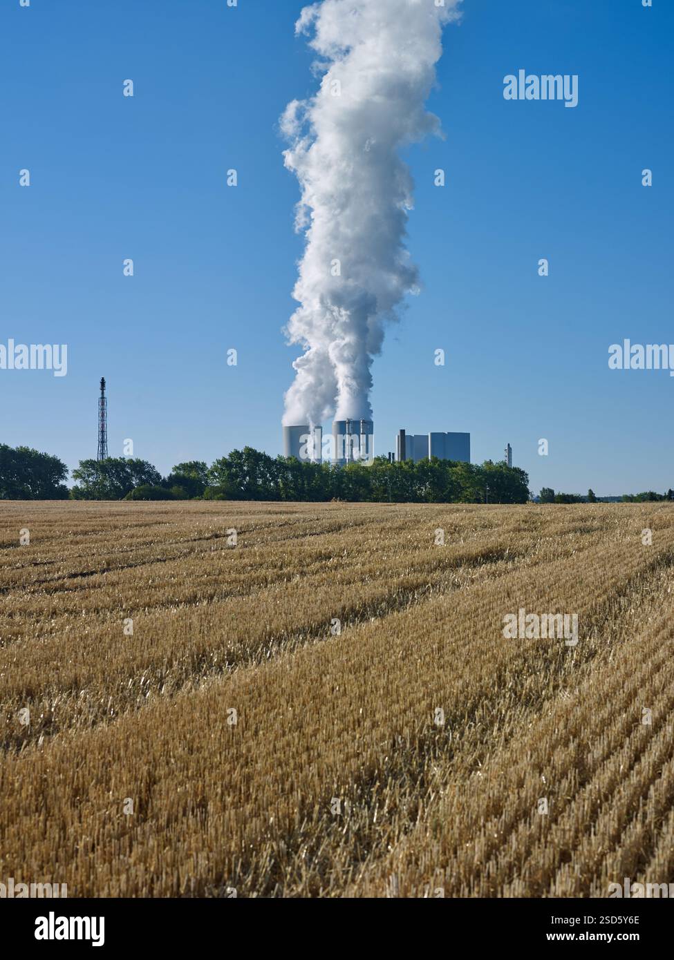 Boehlen, Germany: View over a mowed field to the cooling towers of a ...