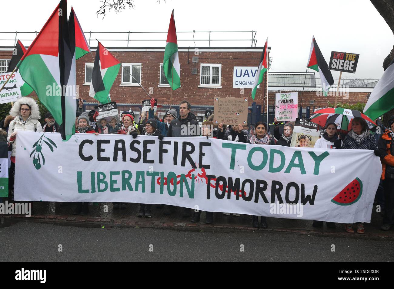 Shenstone, England, UK. 28th Jan, 2025. Protesters gather behind a ...