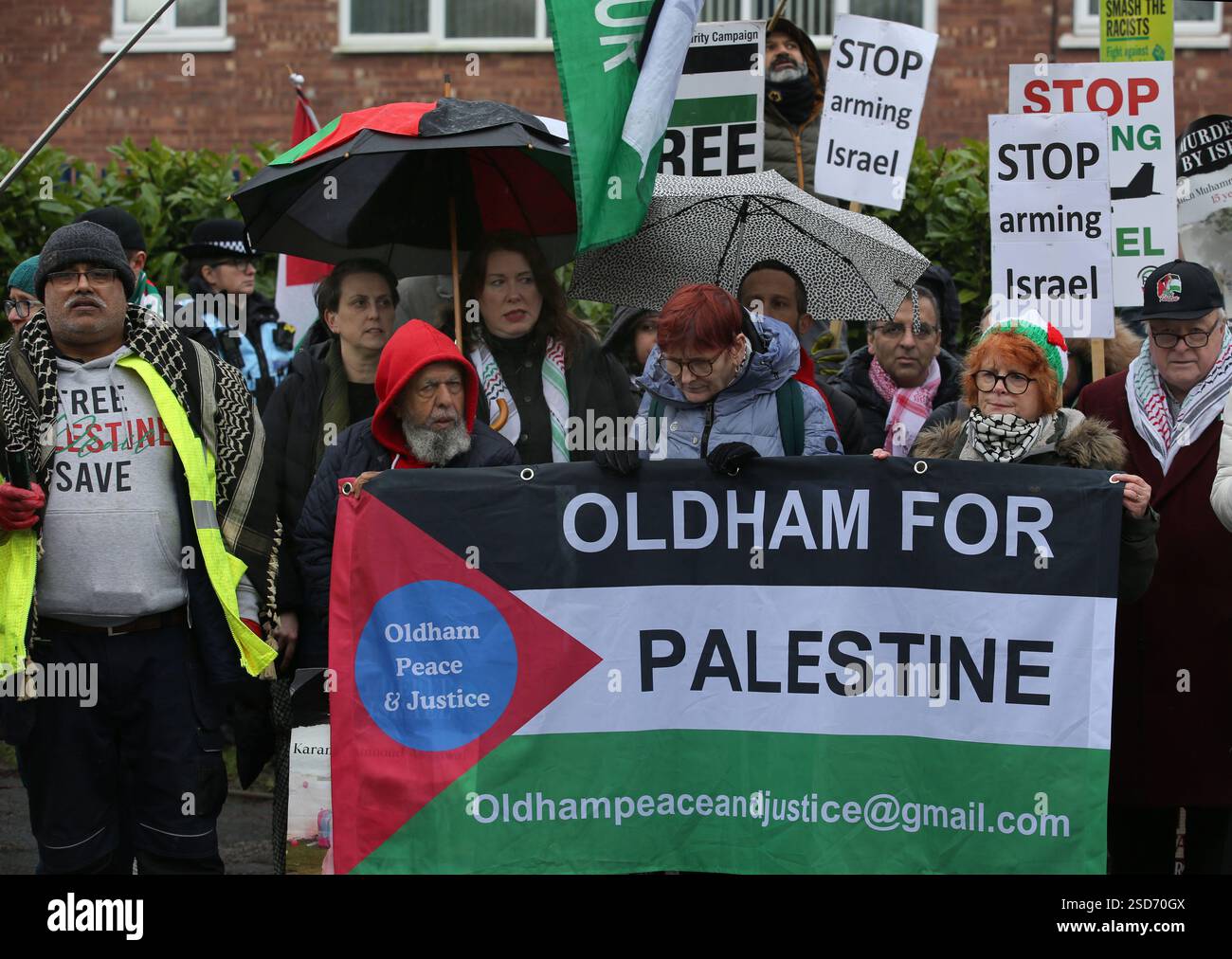 Shenstone, England, UK. 28th Jan, 2025. Protesters gather behind a ...