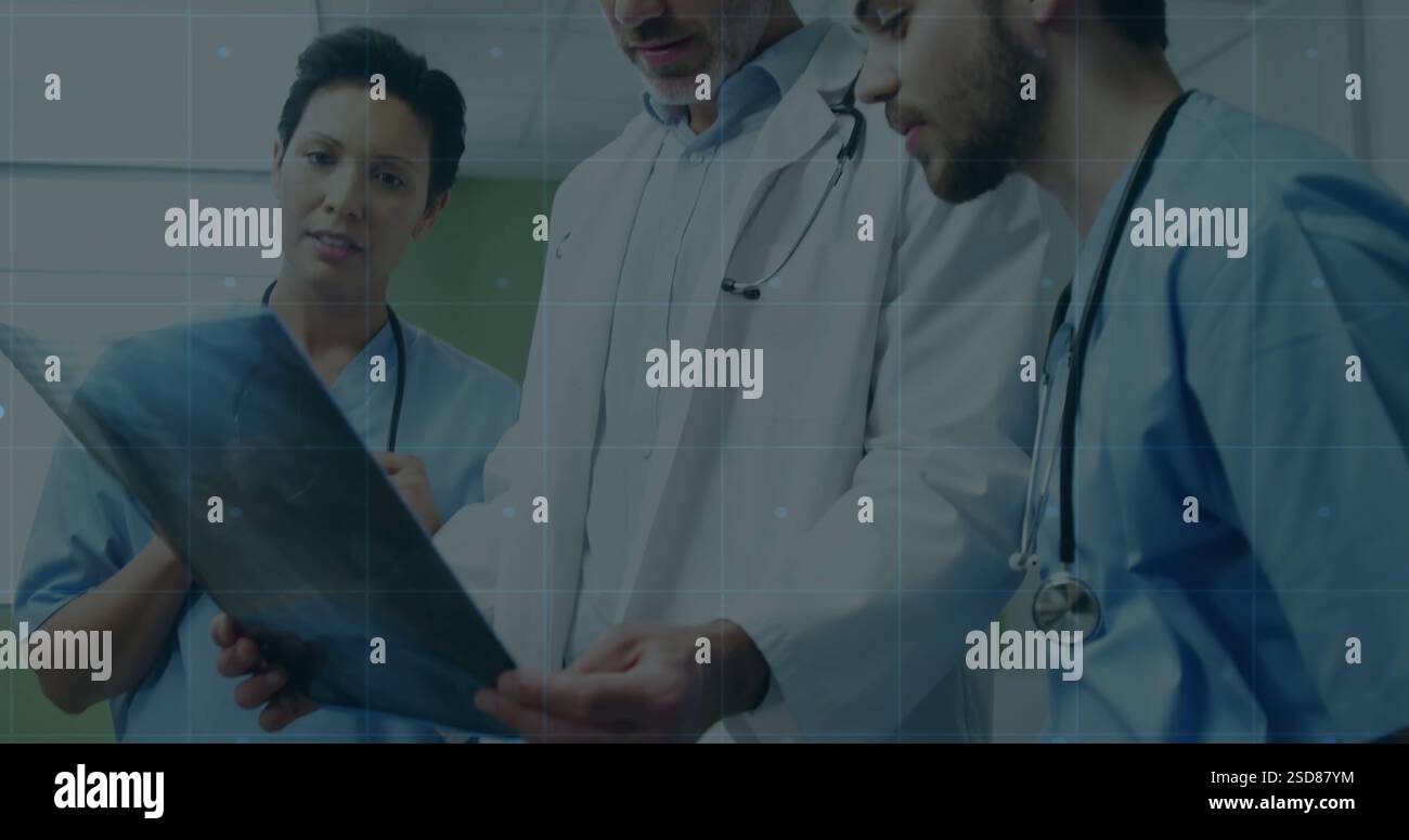 Examining X-ray together, doctors discussing patient diagnosis in ...