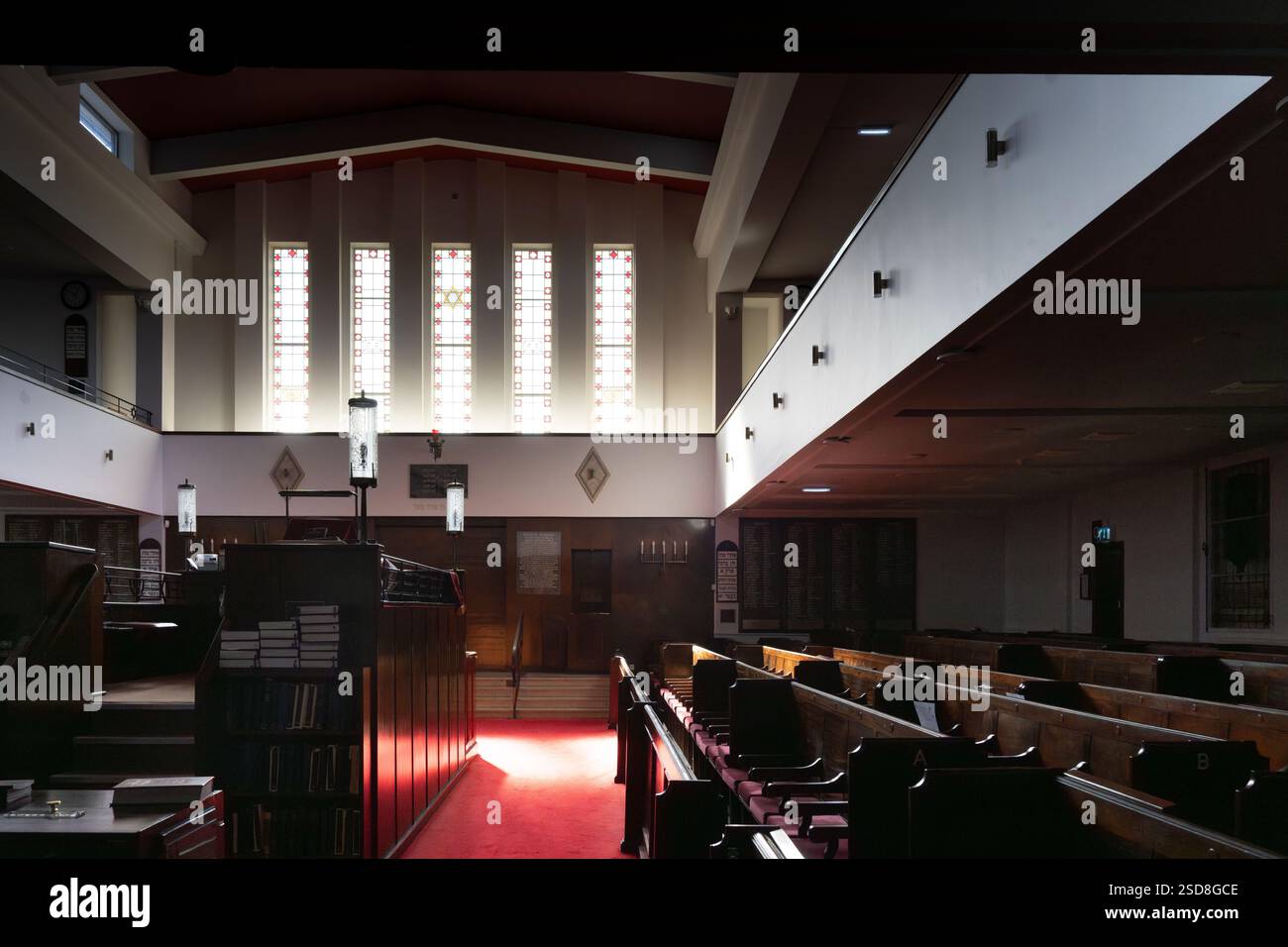 Interior of synagogue in Manchester, England. Sunlight streams through ...
