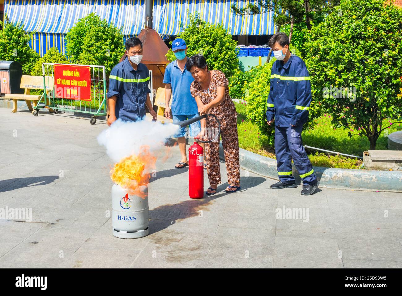 Firefighter demonstration with fire and extinguisher in Ho Chi Minh ...
