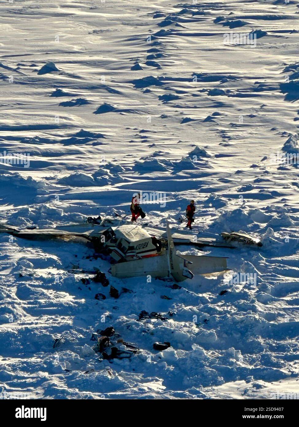 This photo provided by the U.S. Coast Guard on Friday, Feb. 7, 2025, shows a small commuter ...