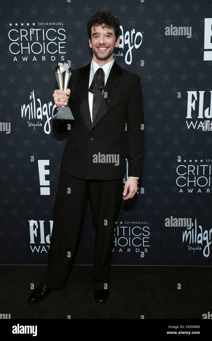 Michael Urie poses in the press room with the award for best supporting ...