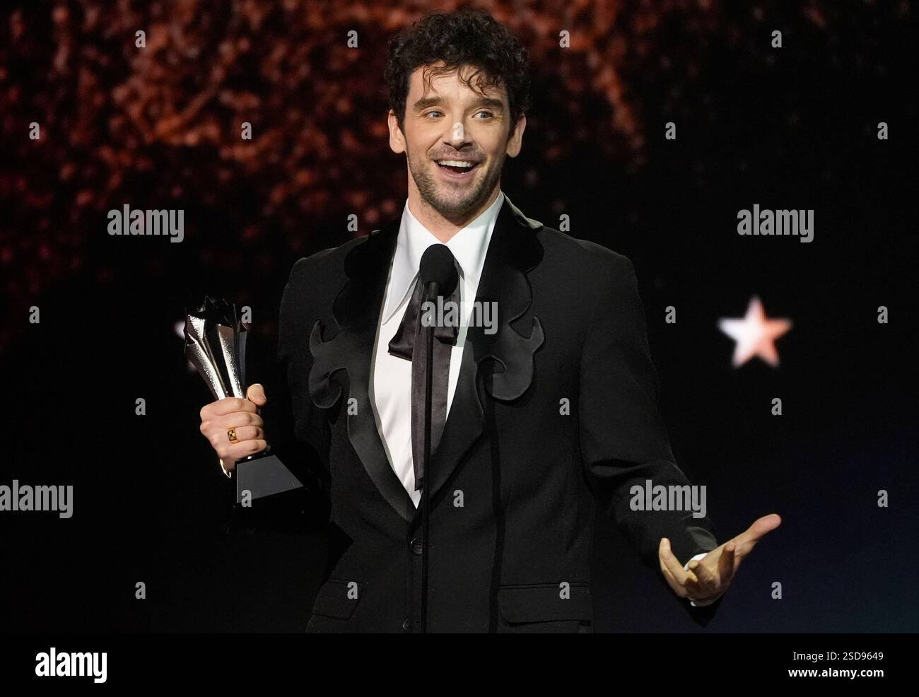 Michael Urie accepts the award for best supporting actor in a comedy ...