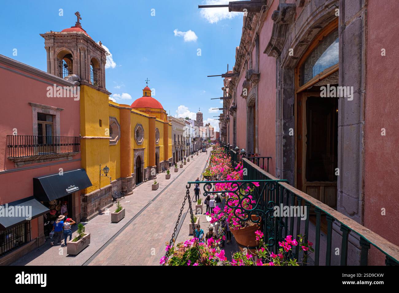 View of a walkway street from a colonial baroque house balcony in ...