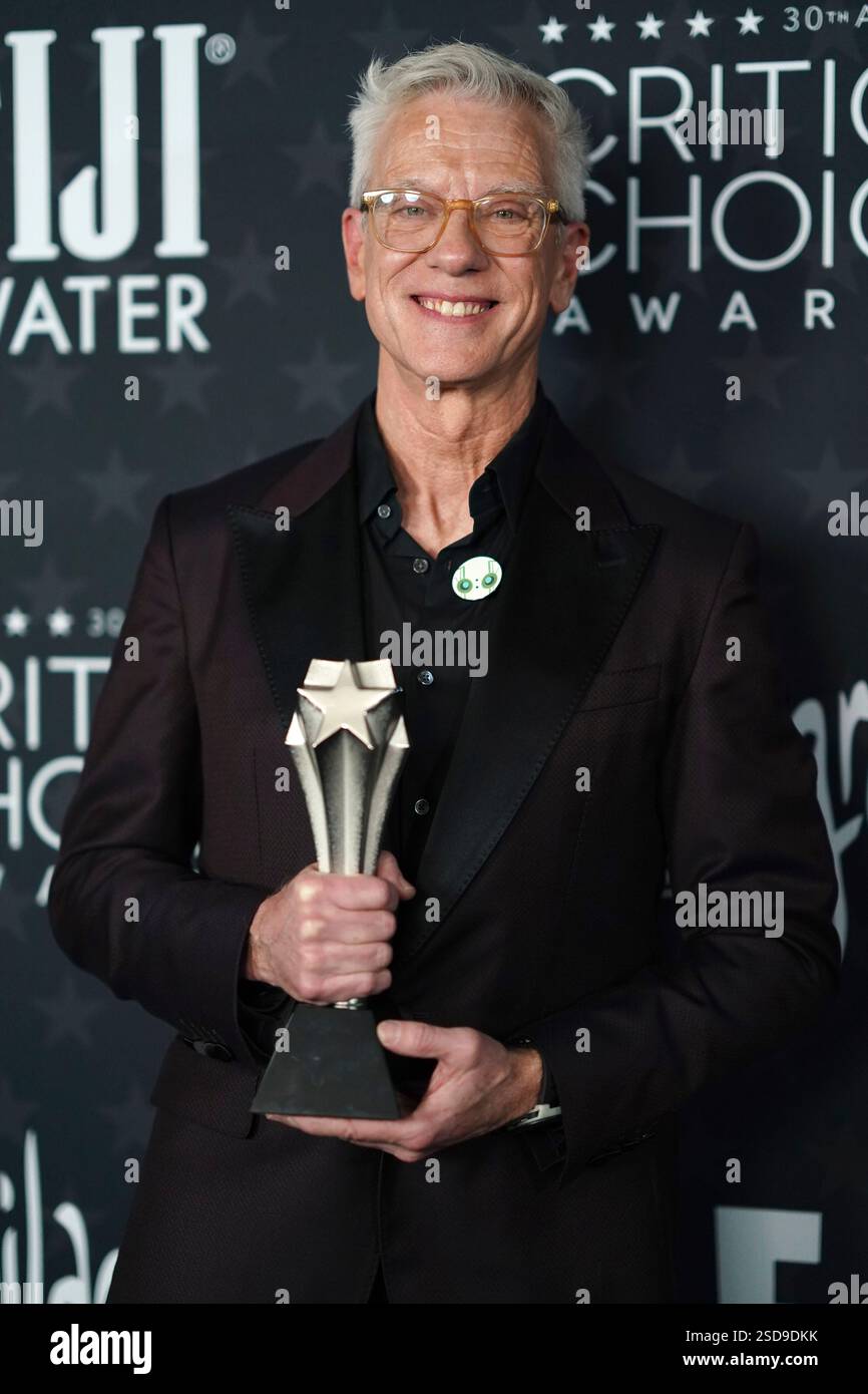 Chris Sanders poses in the press room with the award for best animated ...