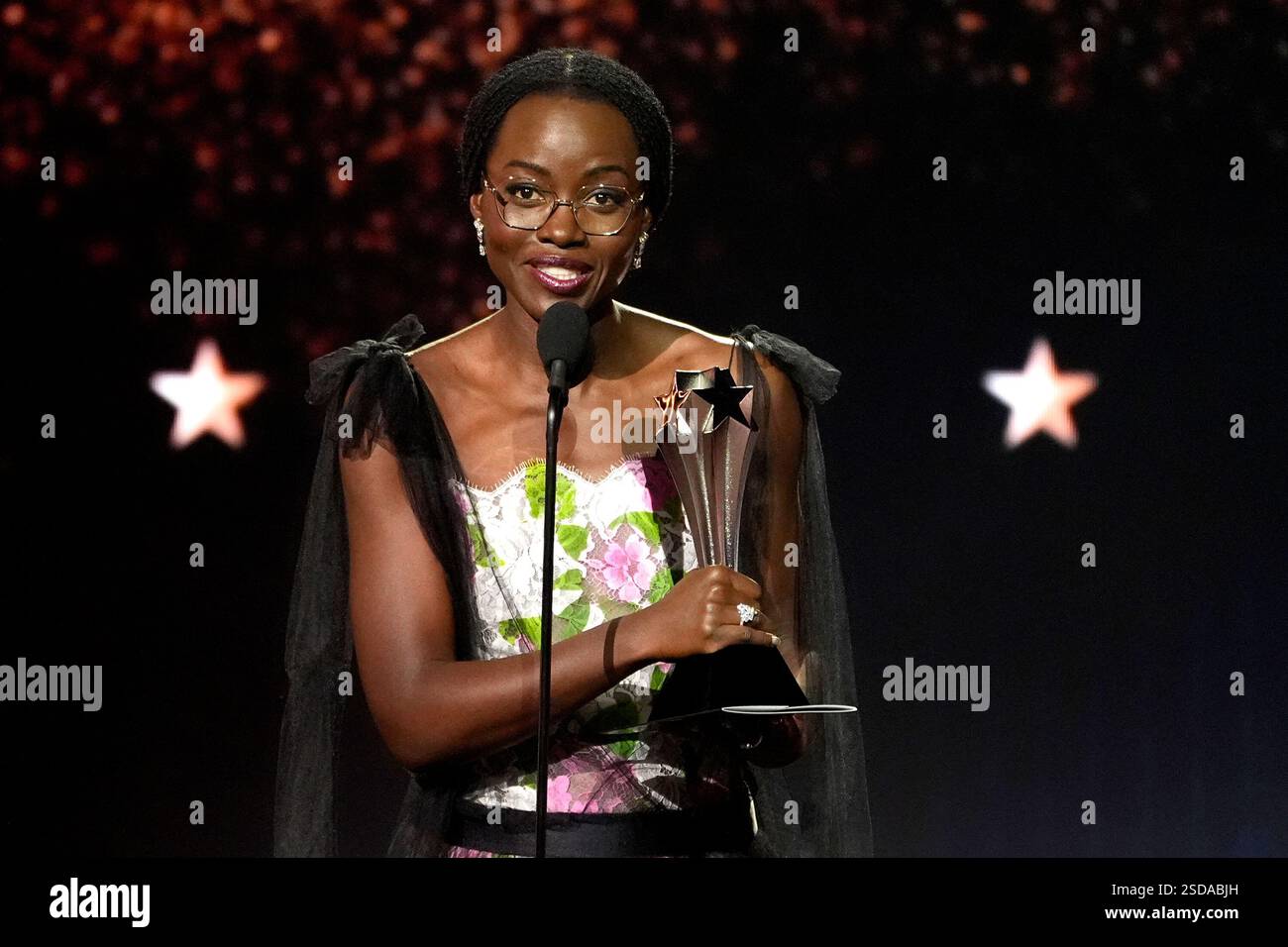 Lupita Nyong'o presents the award for best supporting actor during the ...