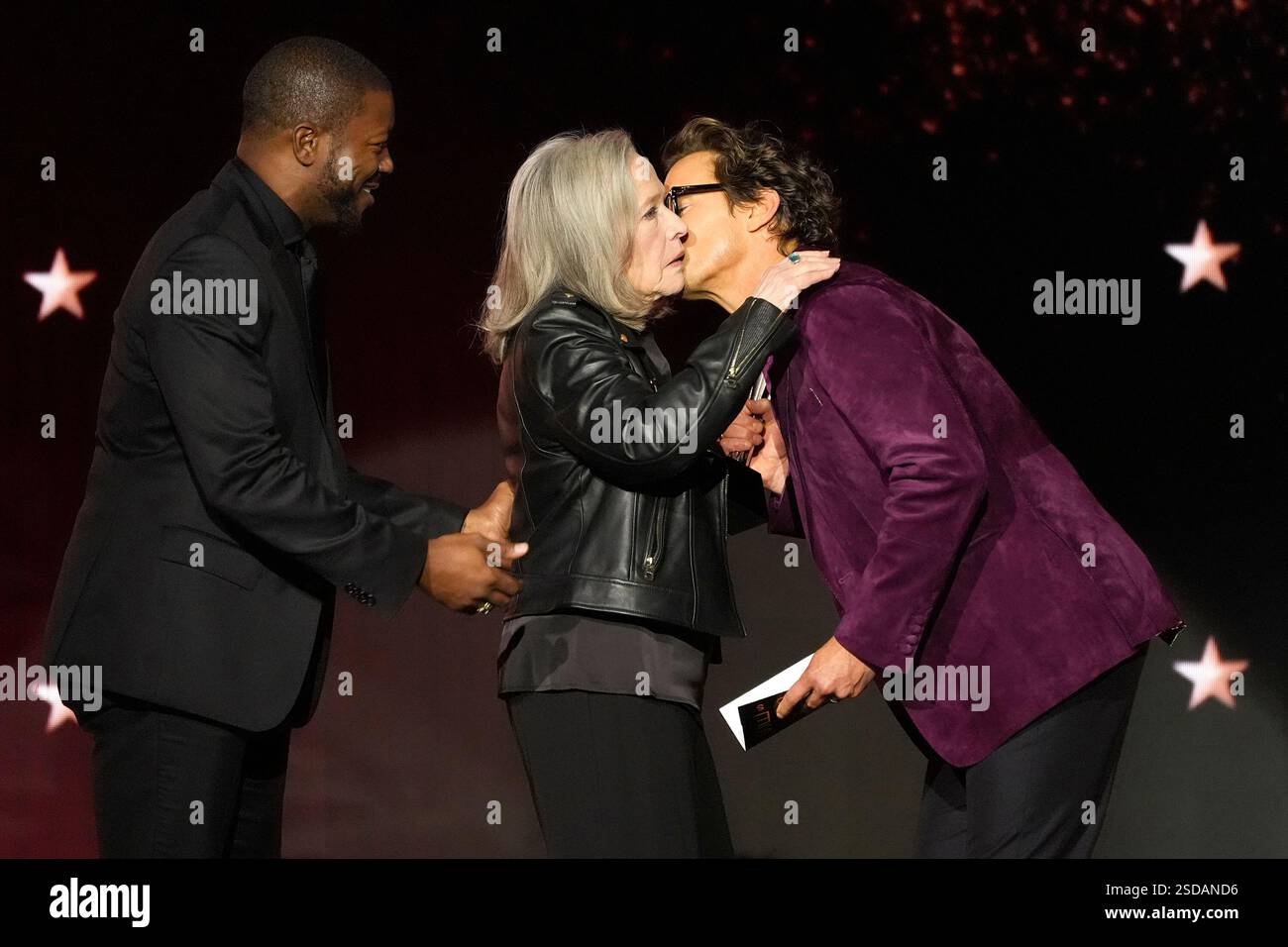 Matt Bomer, right, presents the award for best actress in a drama ...
