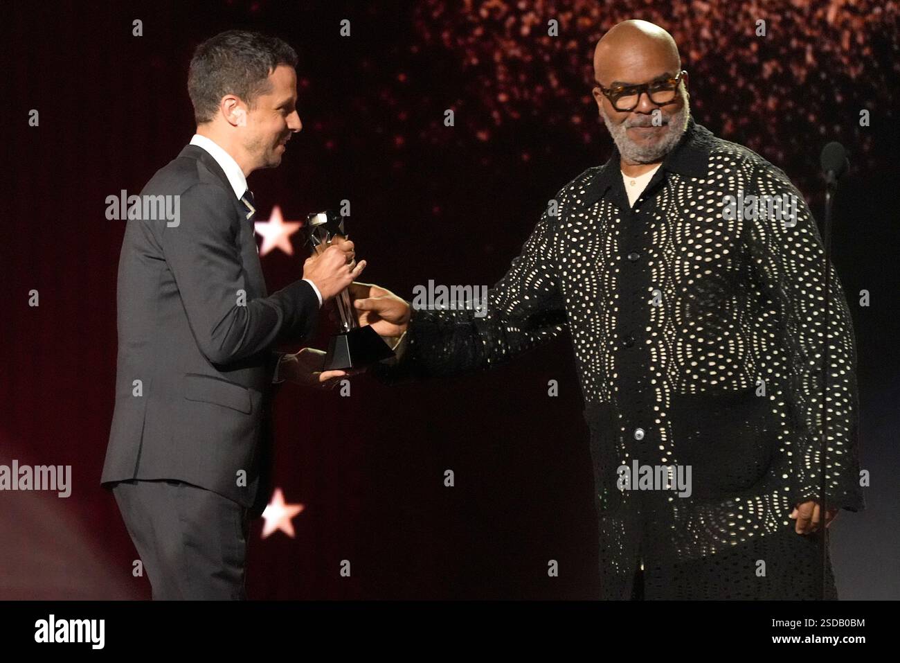 David Alan Grier, right, presents the award for best drama series to ...