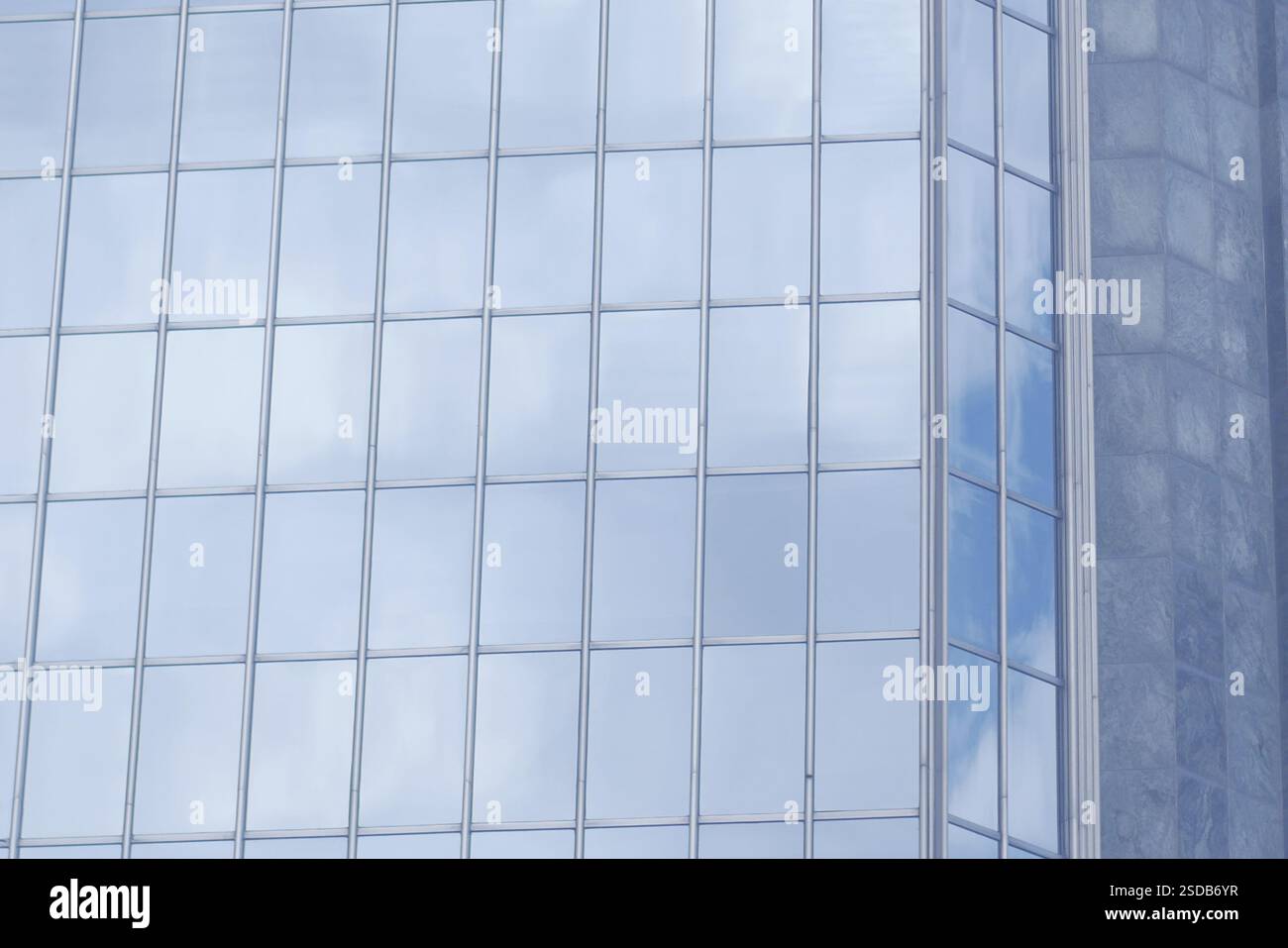 Reflective glass surfaces showing clouds in urban setting Stock Photo ...