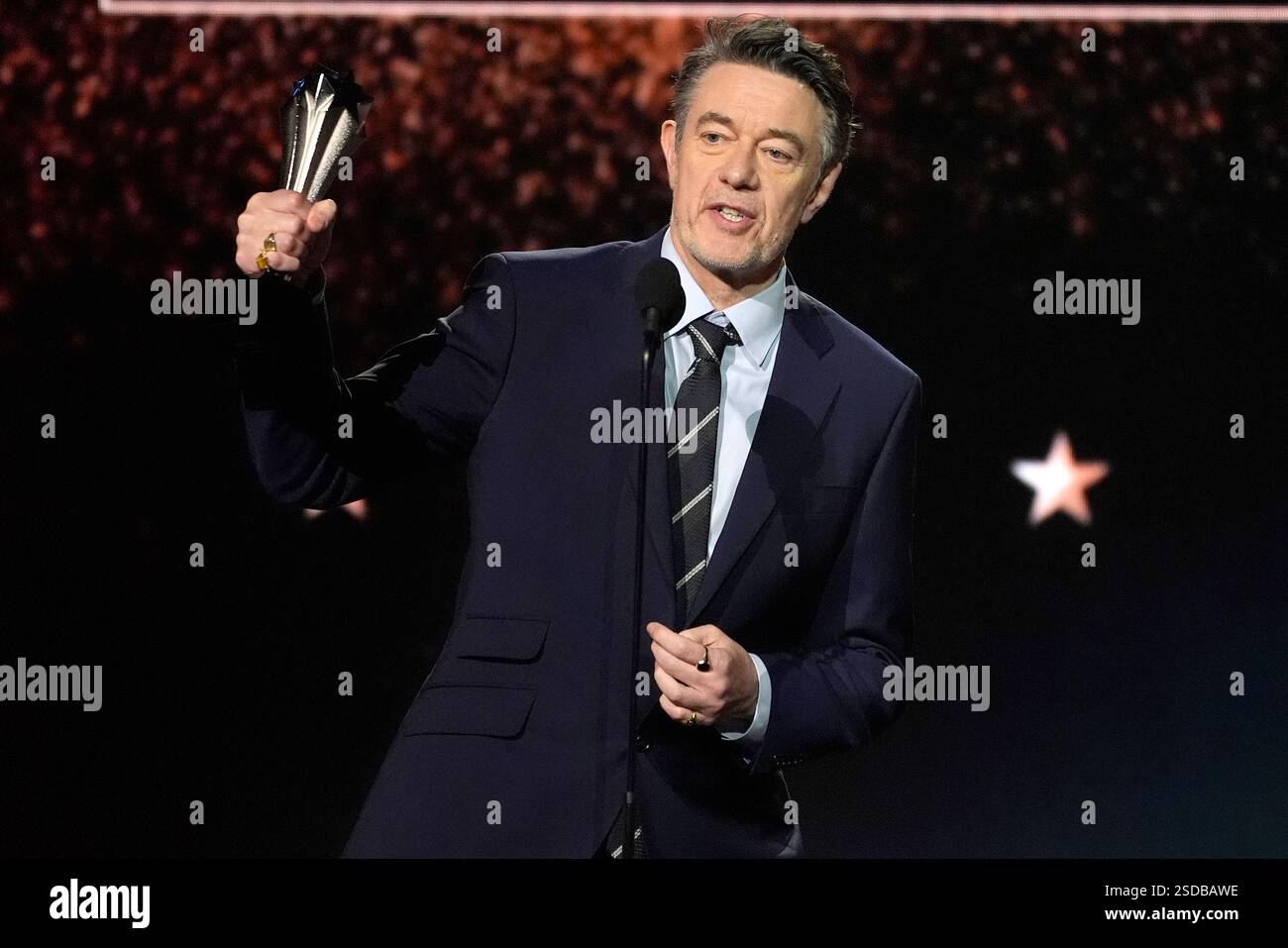Peter Straughan accepts the award for best adapted screenplay for ...